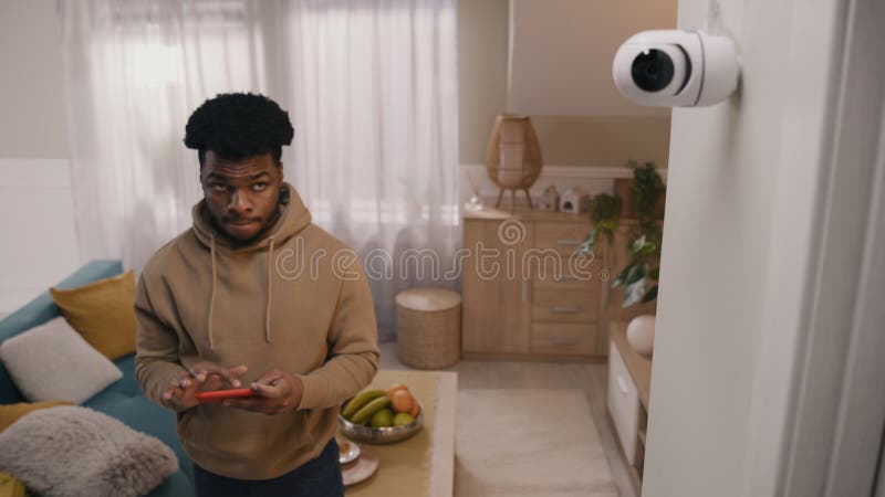 Man Sets Up Angle of CCTV Camera Using Smartphone Stock Image - Image ...