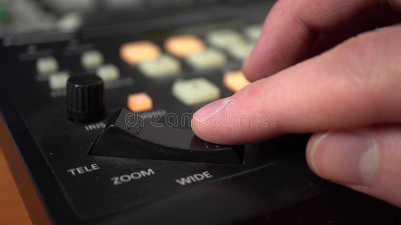 A Man Sets Up Remotely Controlled Cameras. Camera Control Panel. Hand ...