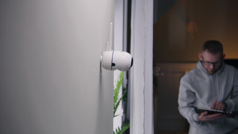 Man Sets Up Security Camera with Tablet Stock Video - Video of gadget ...