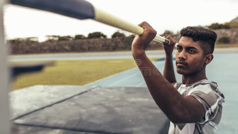 Man Setting the Bar for High Jump Stock Photo - Image of training ...