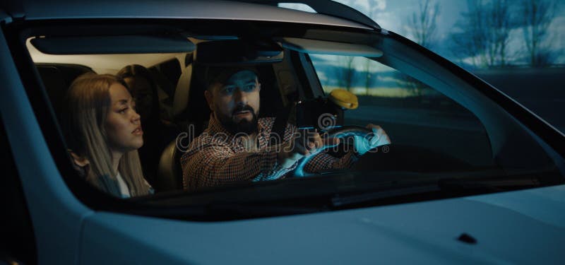 Man Setting Car GPS while Driving Stock Image - Image of speaking, male ...