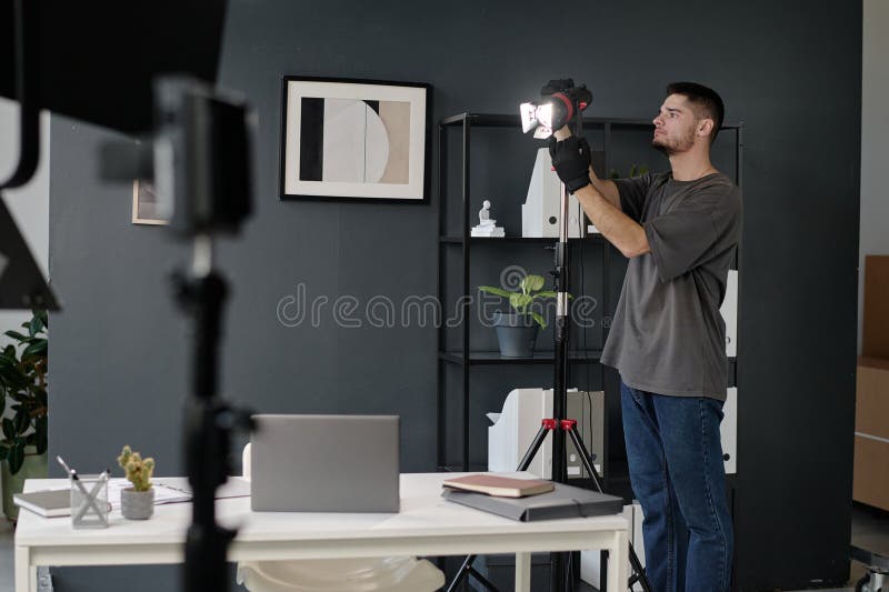 Man Setting Light at Studio Stock Photo - Image of editor, videographer ...
