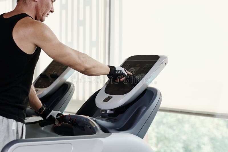 Man Setting Speed on Treadmill Stock Image - Image of treadmill ...
