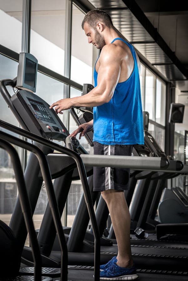 Man setting treadmill stock photo. Image of runner, fitness - 48263886