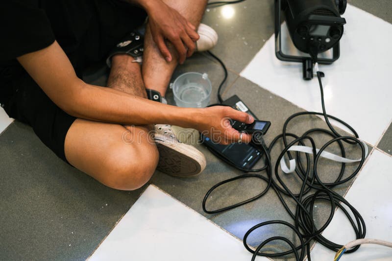 A Man Setting Up a Continuous Lighting Stock Photo - Image of industry ...