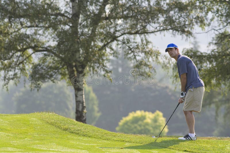 Man Setting Up Golf Shot - Horizontal Stock Image - Image of calm ...