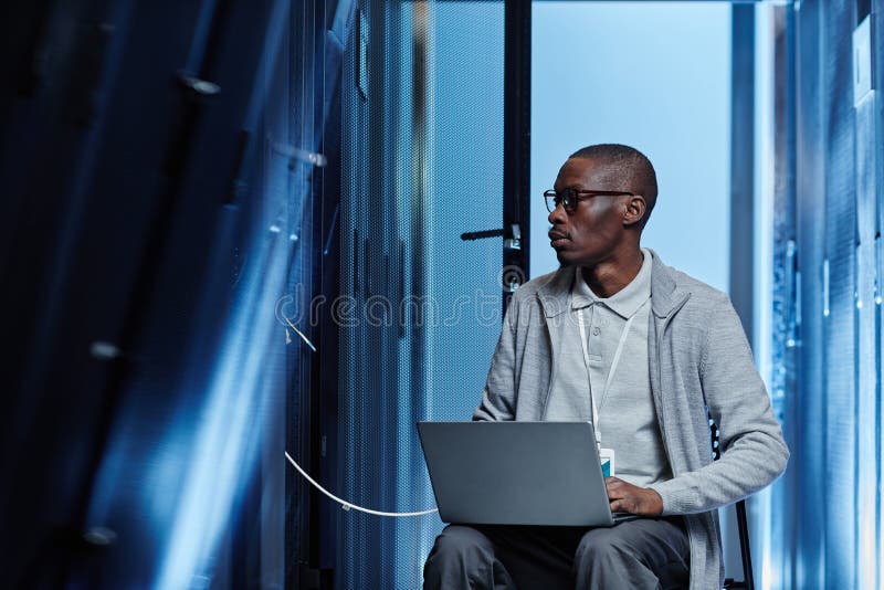 Man Setting Up Server stock photo. Image of supercomputer - 250344646