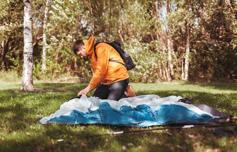 Man Setting Up Tent Outdoors Stock Photo - Image of assembling ...