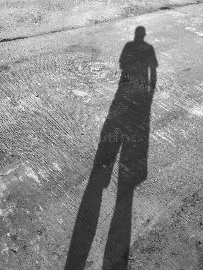 A man with a shadow stock image. Image of background - 139363359