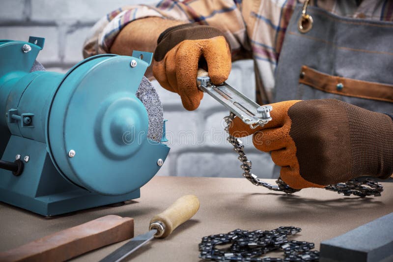 Man Sharpening a Chainsaw Chain Stock Photo - Image of workwear, males ...