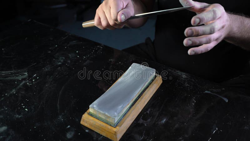 Man sharpening knife blade stock video. Video of steel - 354122457