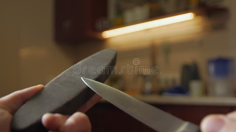 A Man Sharpens a Knife stock video. Video of stone, hand - 209638907
