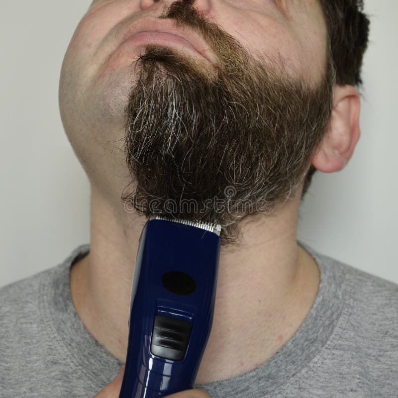 Man who shaves his beard stock photo. Image of senior - 31872086