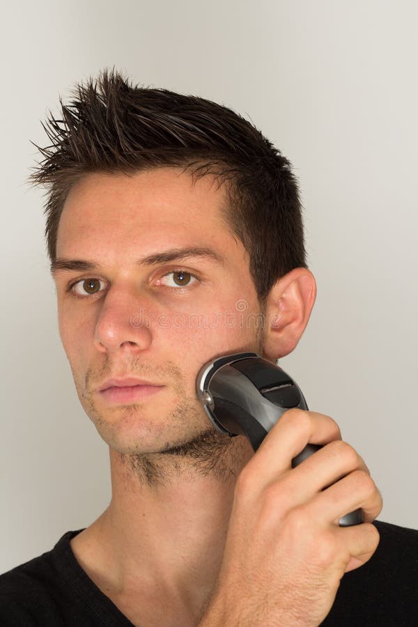 Man shaving beard in face stock image. Image of hair - 22028443