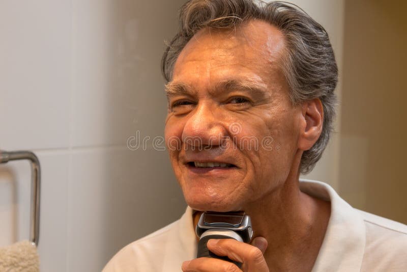 Man Shaving with an Electric Razor or Shaver Stock Photo - Image of ...