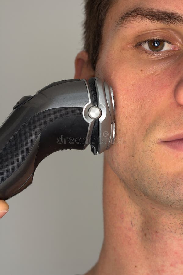 Man Shaving Face with Electric Razor Stock Photo - Image of body, clean ...