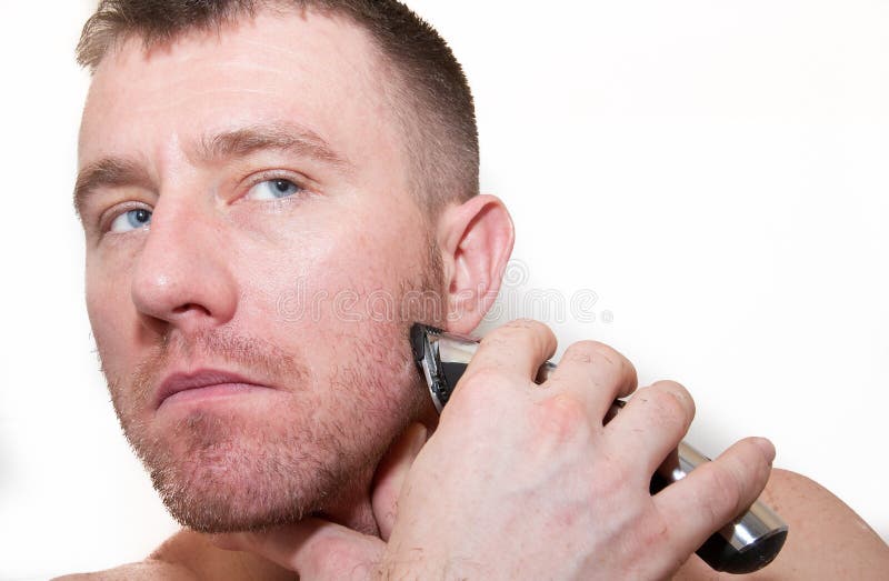 A Man Shaving His Face stock photo. Image of hairy, male - 23635204