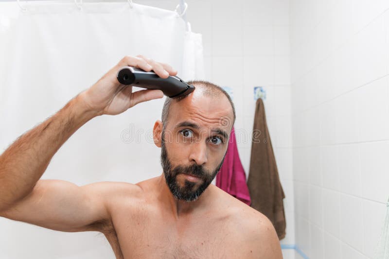 A Man is Shaving His Head with a Razor Stock Image - Image of human ...