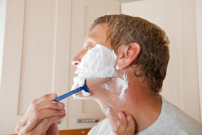 Man Shaving Face with Razor Stock Photo - Image of person, clean: 111105960