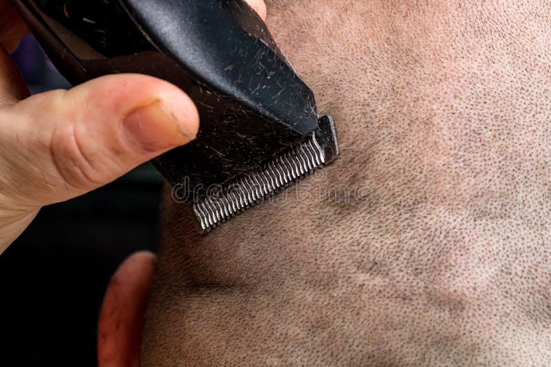 Man Shaving or Trimming His Hair Using a Hair Clipper Stock Photo ...