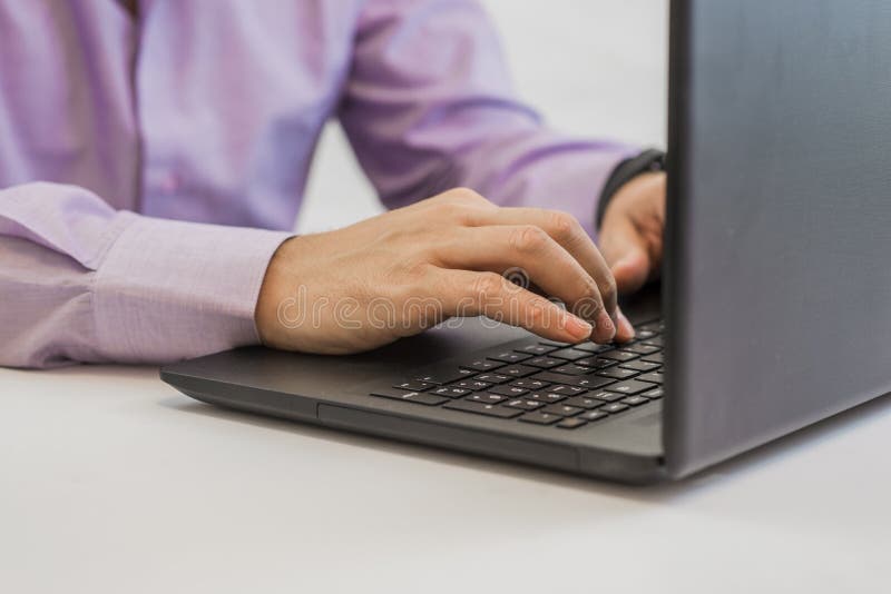 Man in Shirt Using Laptop and Thinking in His Office Stock Photo ...
