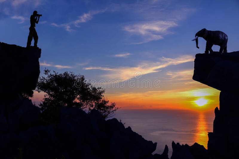 Man Shooting an Elephant on the Mountain. Stock Image - Image of ...