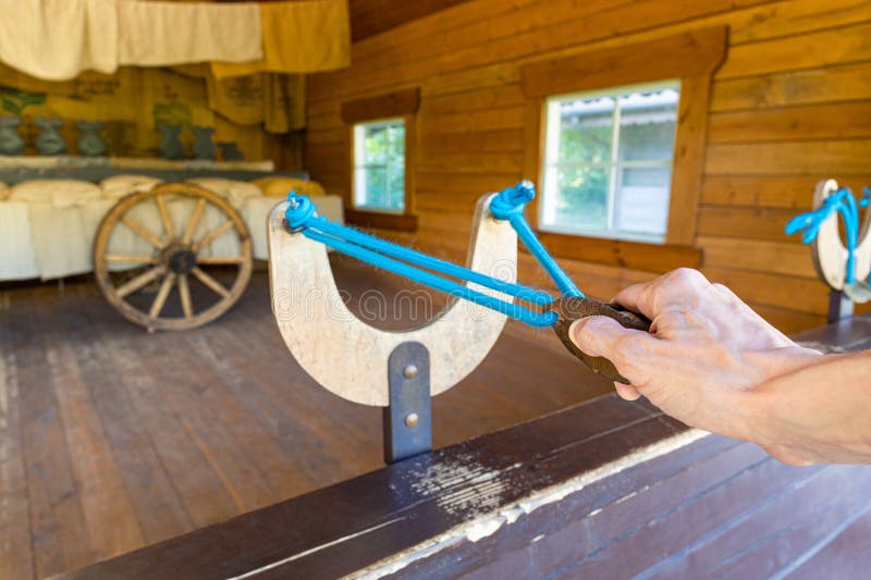 A Man in a Shooting Range Shoots a Slingshot Stock Photo - Image of ...