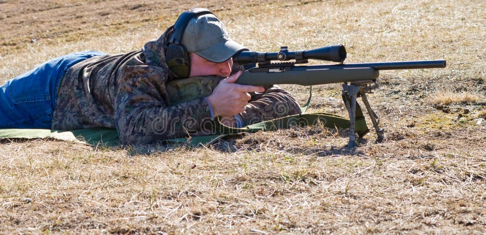 Man Shooting Rifle stock photo. Image of optic, sport - 13060052