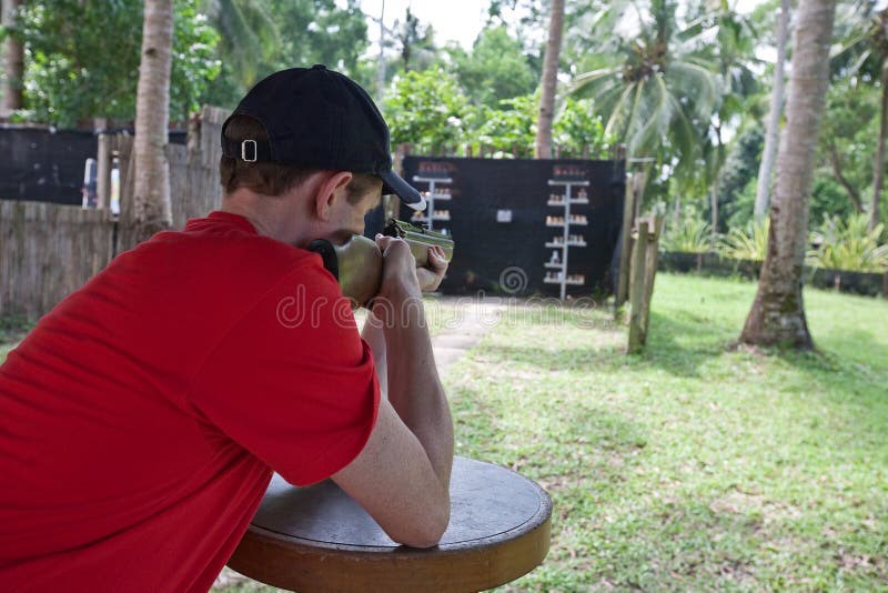 Man Shooting Target with Rifle Stock Photo - Image of confident, sport ...