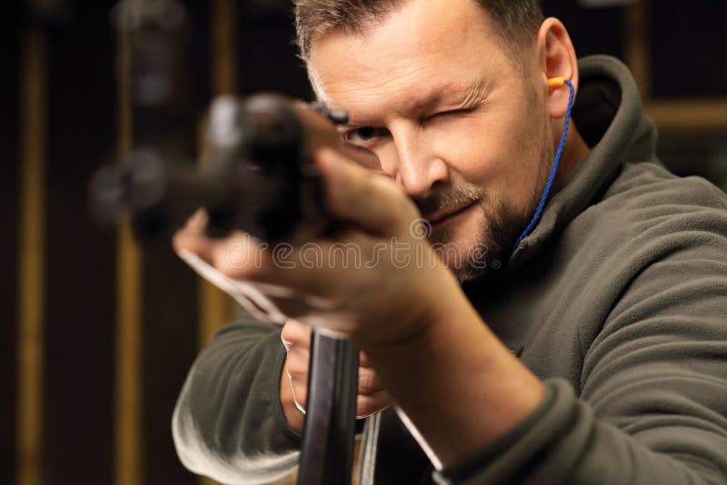 Man Shoots a Rifle Shooting Range Stock Image - Image of armor, range ...