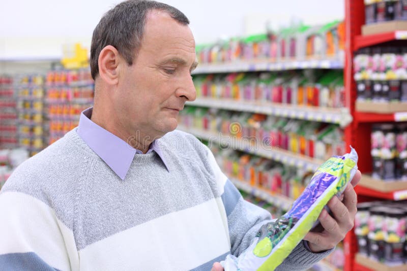 Man in Shop with Package in Hands Stock Image - Image of choose, male ...
