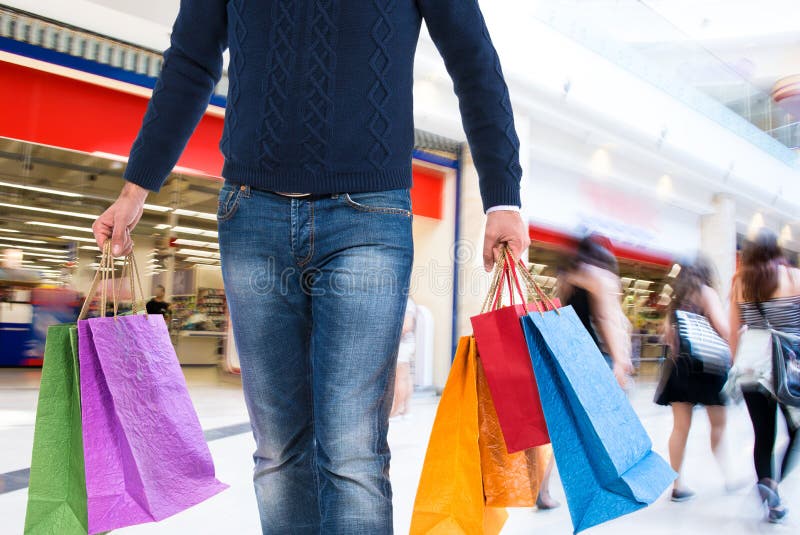 Man with shopping bags stock photo. Image of buyer, shopper - 48274942