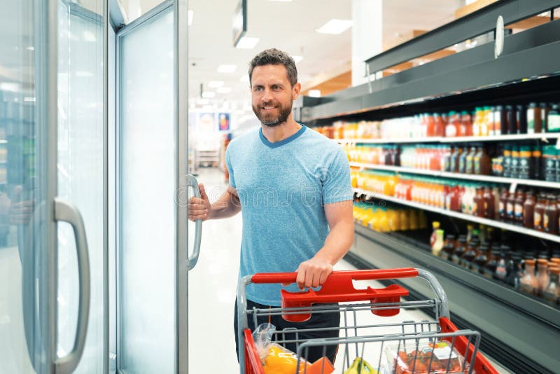 Man with Shopping Cart in a Grocery Store. Stock Image - Image of ...