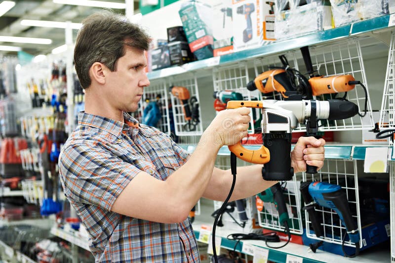 Man Shopping for Perforator in Hardware Store Stock Photo - Image of ...