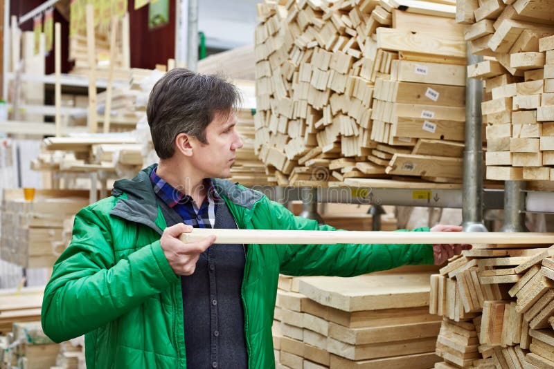 Man Shopping for Timber in Shop Stock Image - Image of front, decision ...