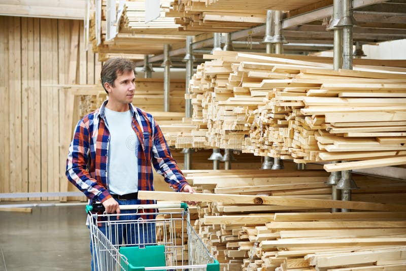 Man Shopping for Timber in Shop Stock Photo - Image of timber, color ...