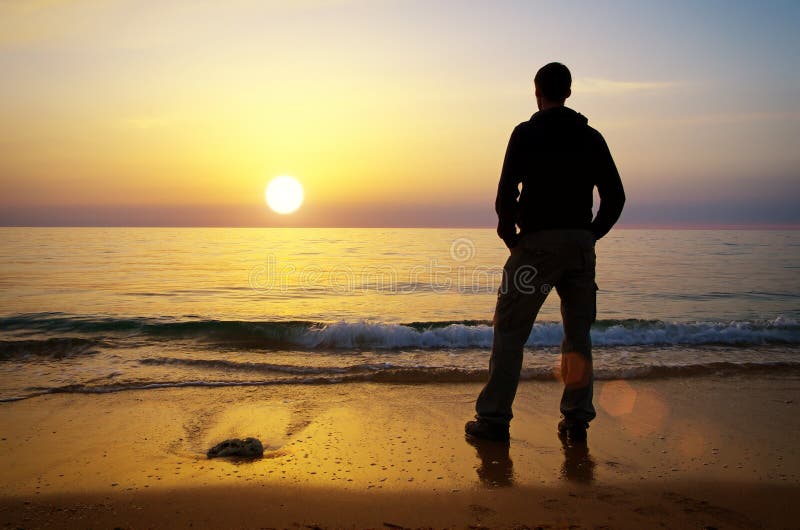 Man on the shore stock image. Image of alone, dusk, sunlight - 57658273