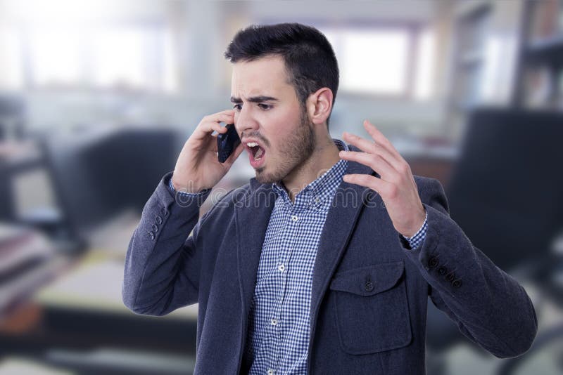 Man shouting by the phone stock photo. Image of office - 94709076
