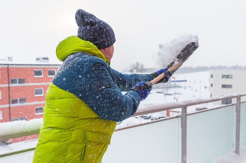 Man Shoveling the Show on the Terrace Stock Photo - Image of poland ...