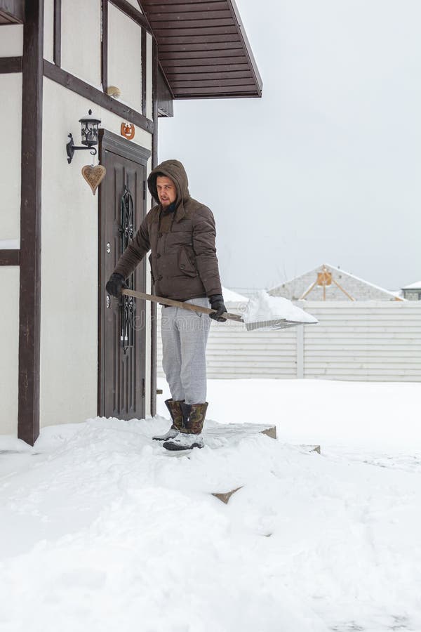 Man Shoveling Snow from the Steps of His House Stock Image - Image of ...