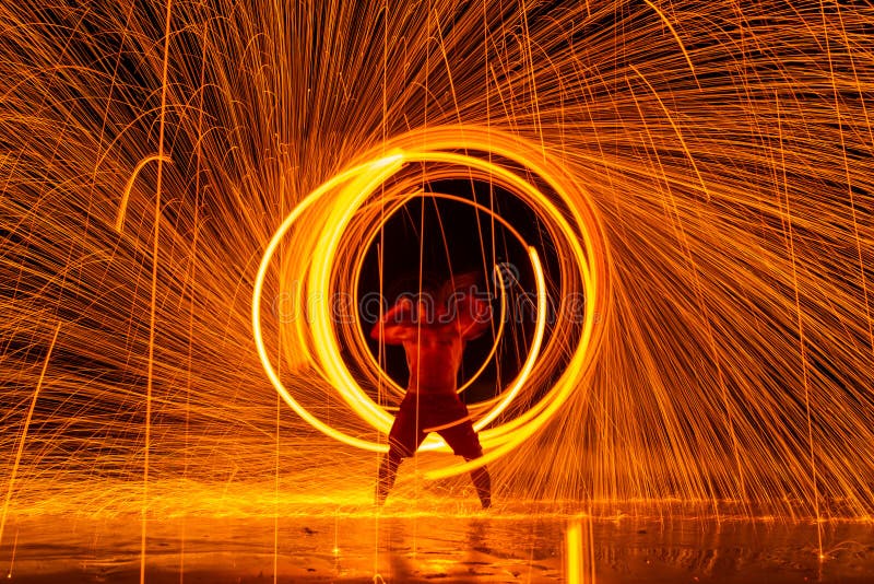 A Man Show the Swirly Fire Show at Koh Samet, Thailand Editorial ...