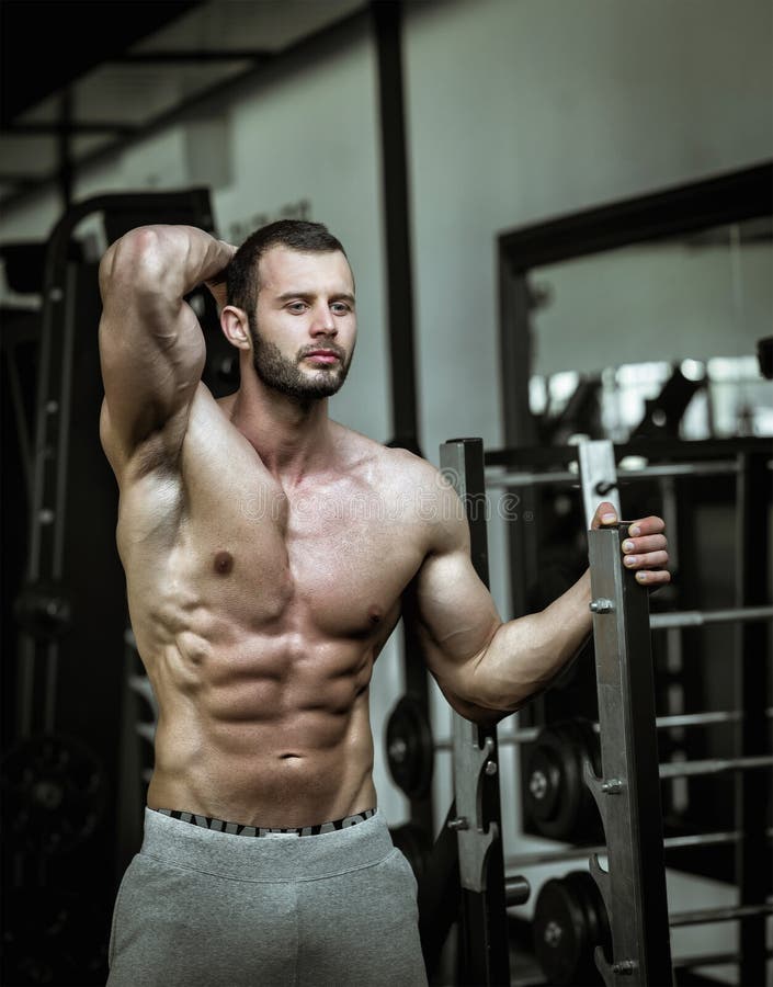 Man showing abs in gym stock photo. Image of people, lifting - 53086558