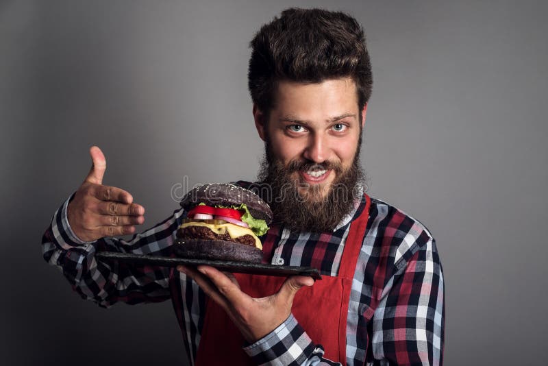 Man showing burger stock photo. Image of homemade, cheerful - 117082990