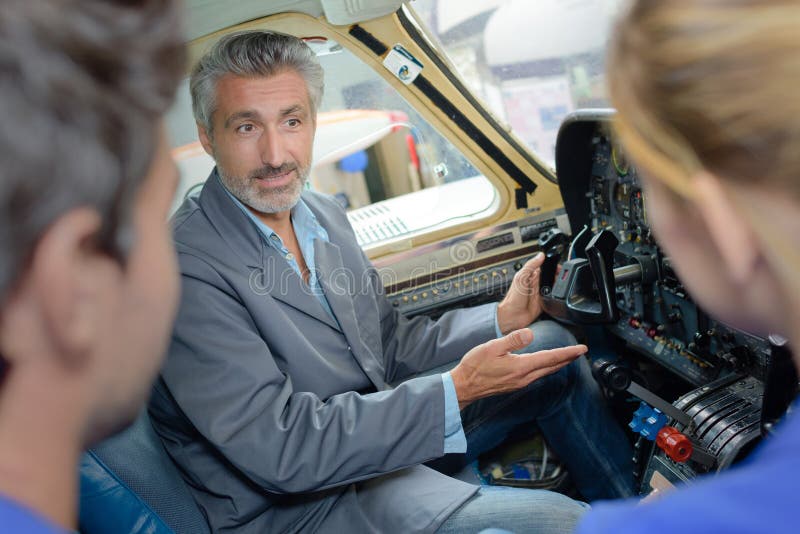 Man Showing Cockpit Controls To Students Stock Image - Image of ...