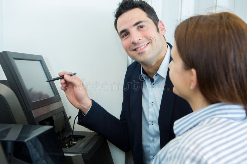 Man Showing Computer and Posing for Camera Stock Photo - Image of ...