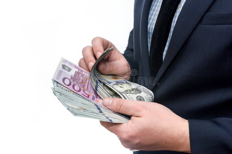 Man Showing Euro Banknote between Dollar Pile Stock Photo - Image of ...