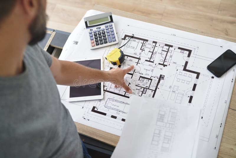 Man Showing a Finger on Blueprints Stock Photo - Image of paper ...