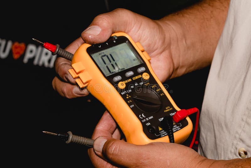 Man showing a multimeter. editorial stock photo. Image of person ...