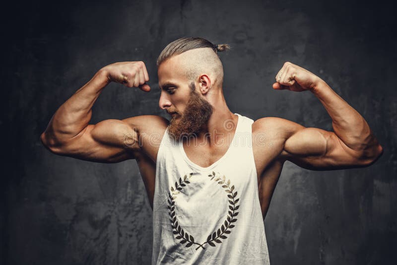 A man showing his biceps. stock image. Image of bodybuilding - 112973353