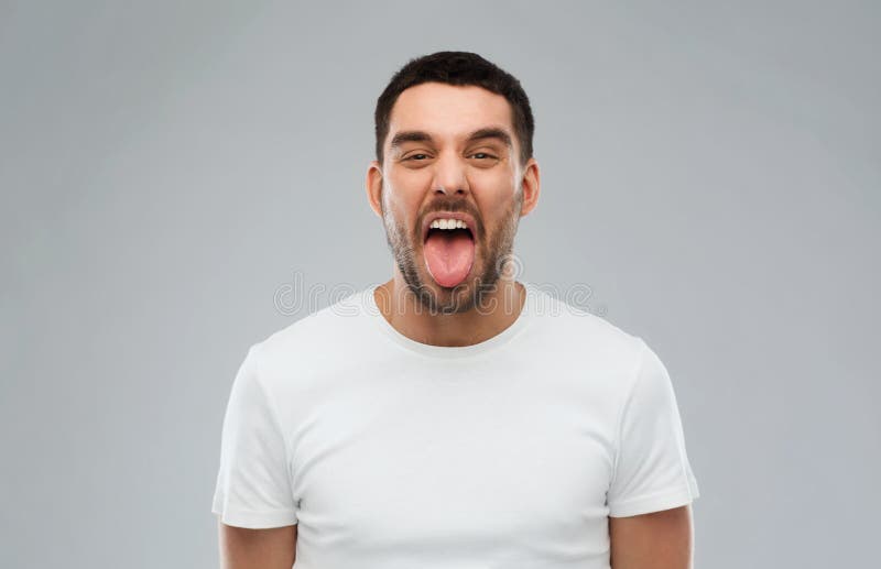 Man Showing His Tongue Over Gray Background Stock Photos - Free ... Man Showing His Tongue Over Gray Background Stock Photos - Free ...